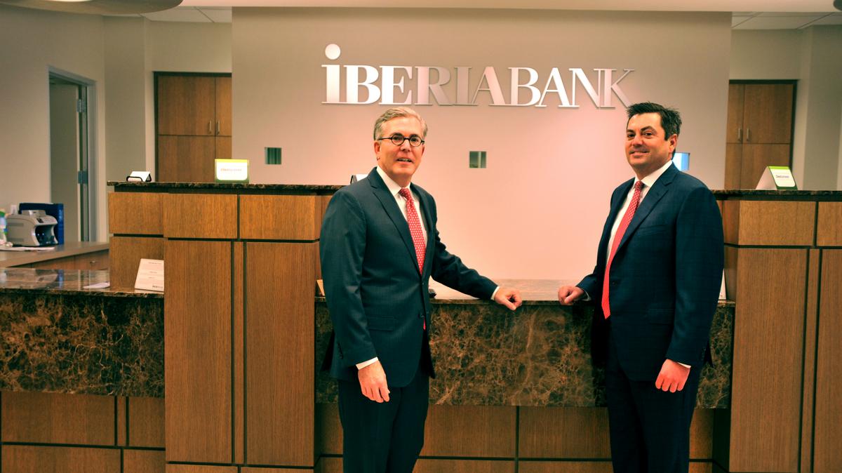 Gregory K. Smithers and Nathan Raines of Iberia Bank, received ...