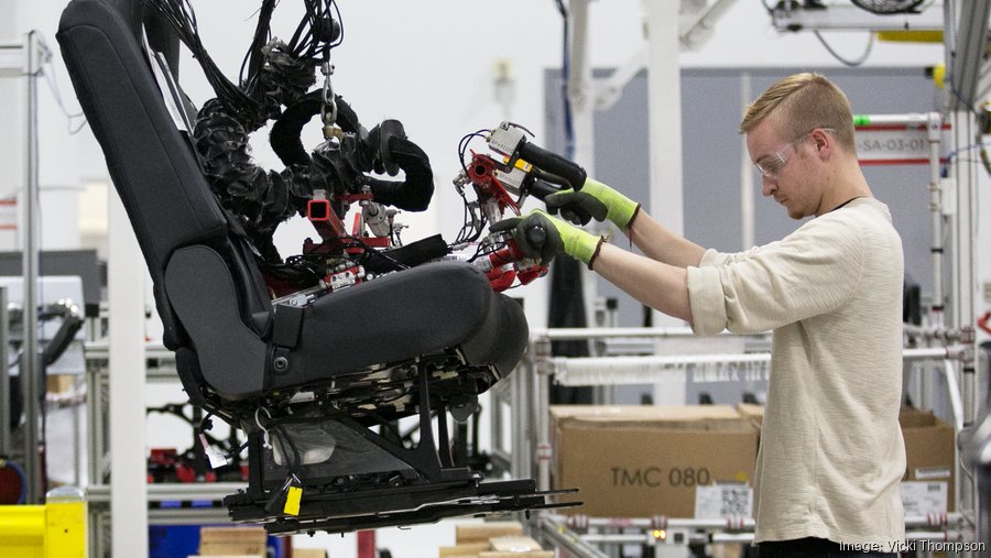 Tesla workers allowed to wear union insignia on work shirts - Silicon ...