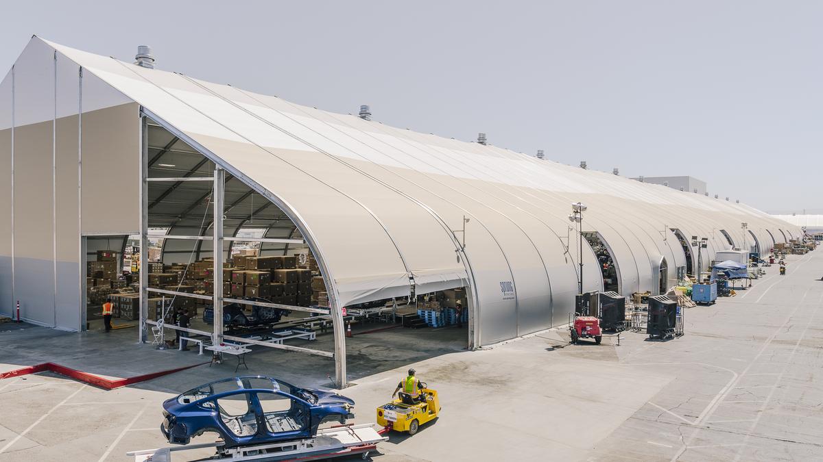 Tesla is moving employees from other divisions to work on Model 3 sedan ...