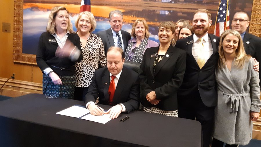 Gov. Jared Polis signs law to create program simplifying Colorado's ...