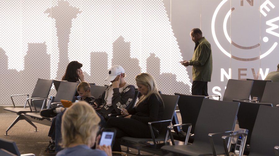 Passengers are pictured in the newly unveiled North Satellite terminal ...