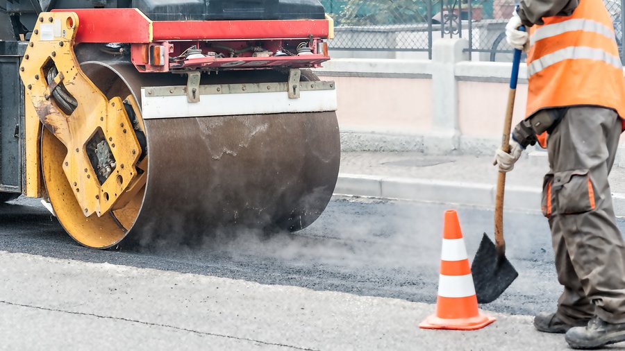 Low Section Of Man Working On Road