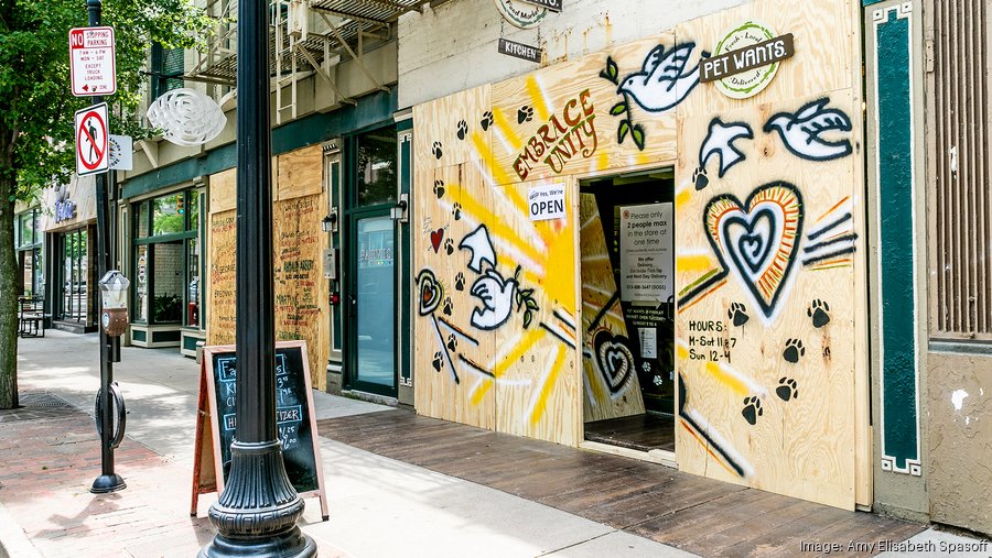 Artists cover boarded-up OTR businesses with murals: PHOTOS ...