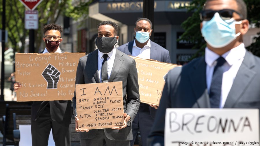 To protest police brutality, Black professionals stand, silent, at ...