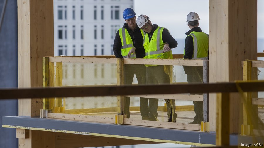 Ascent mass timber building reaches record-setting height with topping ...