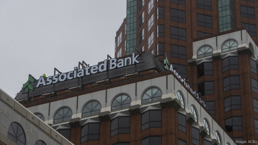 See helicopter install new signage on Associated Bank River Center ...