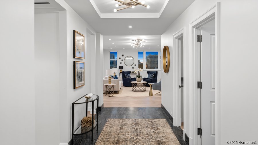 Half of Tom Clancy's former Ritz Carlton on market for $3.75M ...