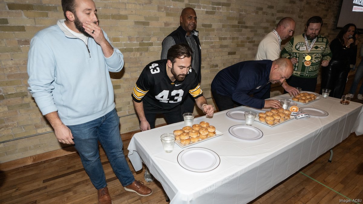 Execs devour 16 donuts to raise money for United Way in 'Donut ...