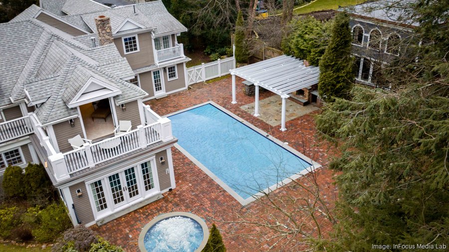 This Old Chestnut Hill estate features a clay tennis court and a cinema ...