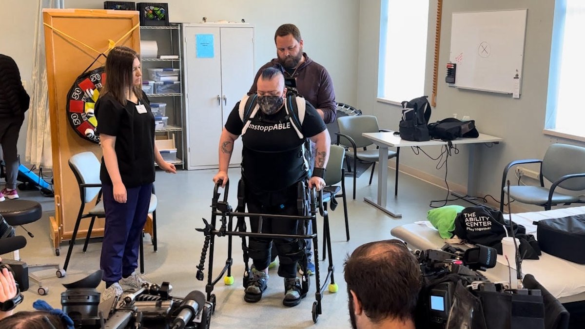 First steps: Exoskeleton helps Milwaukee man learn to walk - Milwaukee ...