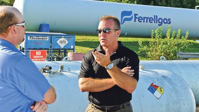 Steve Wambold (right), CEO of Ferrellgas Partners LP, visits with ...