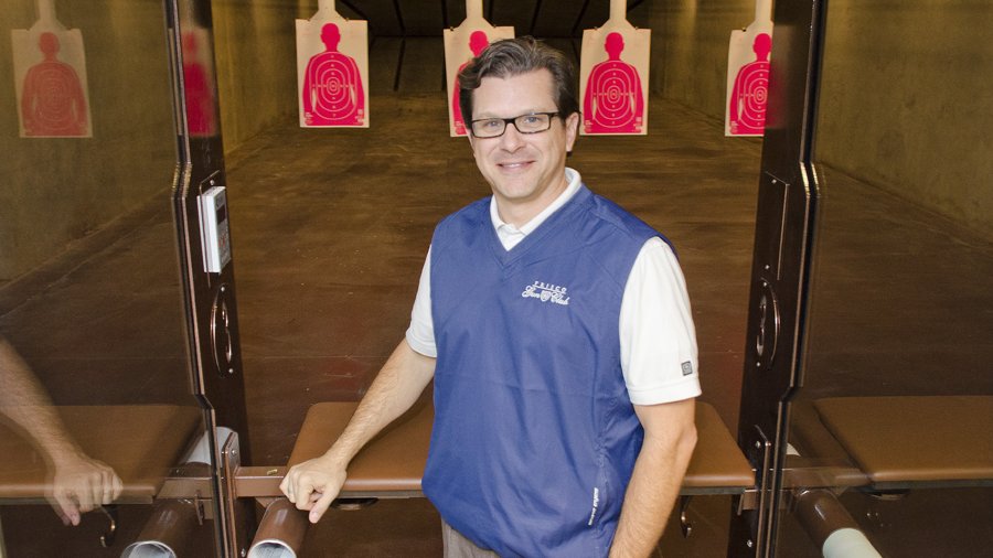 Brandon Johnson, Frisco Gun Club's marketing director, stands in the ...