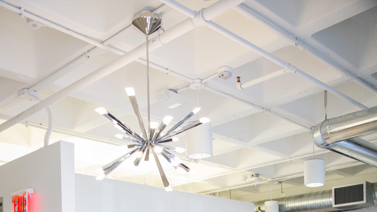 Employees at Humana Inc.'s Digital Experience Center share computer ...