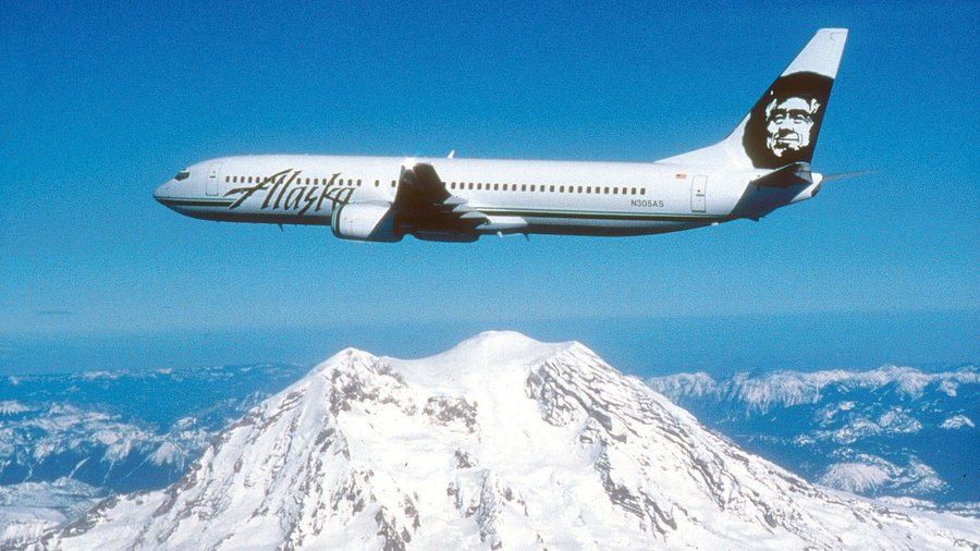 Alaska Airlines plane over mountain