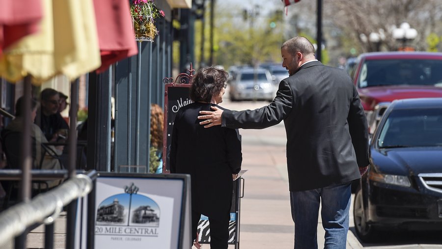 Parker mayor Mike Waid greets a neighbor in bustling downtown.