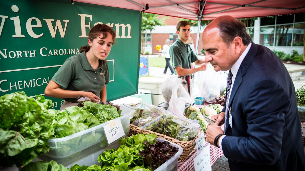 Image of the day: CEO Donald Gintzing shopping at the WakeMed Farmers ...