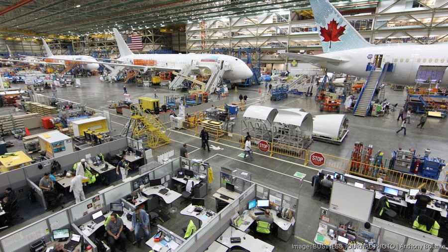 A Boeing 787 jetliner is under construction on the manufacturing floor ...
