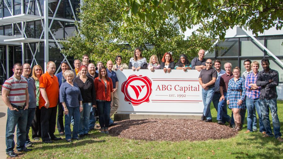 In front of the sign I ABG Capital
