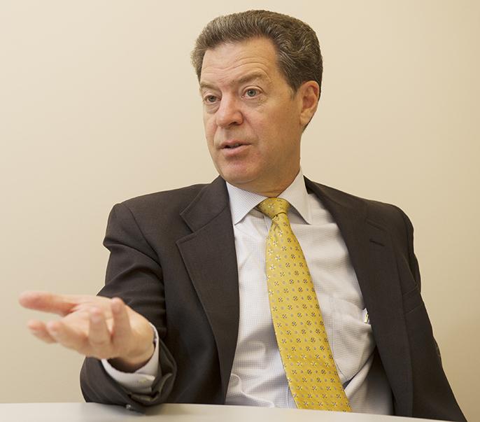 Brownback sees examples for state in New Hampshire and South Dakota ...