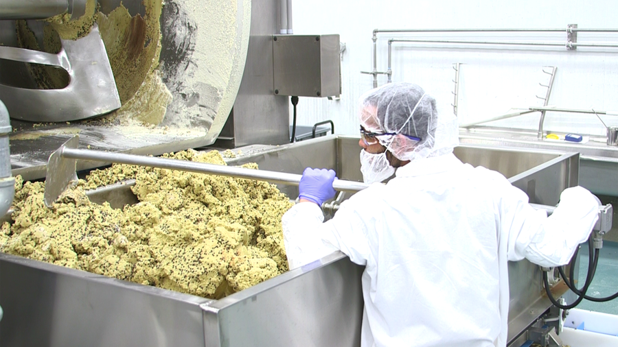 Denali Ingredients employee removing cookie dough