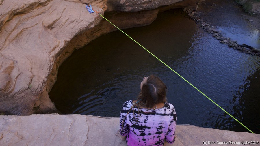 TopSecretSwimmingHoles 102 A swimmer sets up a slackline at Utah's Moab ...